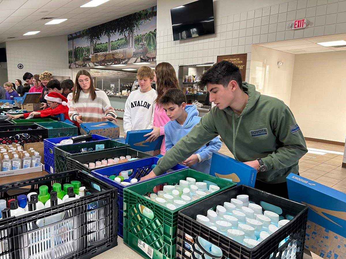 Students share the spirit of giving by packing shoeboxes for those in ...